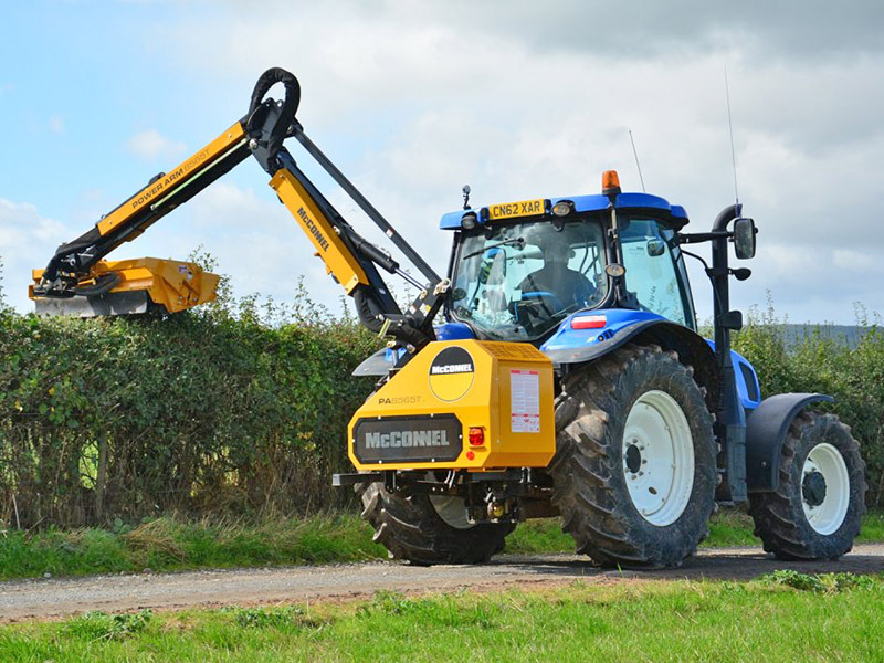 KEEP IT IN TRIM WITH A POWER ARM - T H WHITE Agriculture